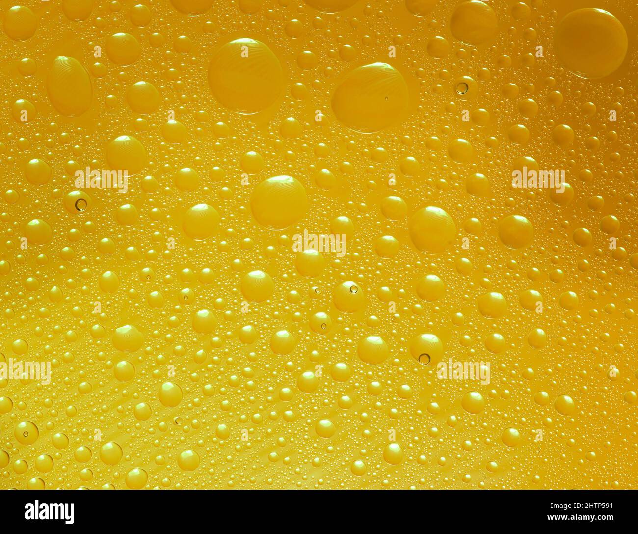 yellow water drops background.close up of water drops Stock Photo - Alamy