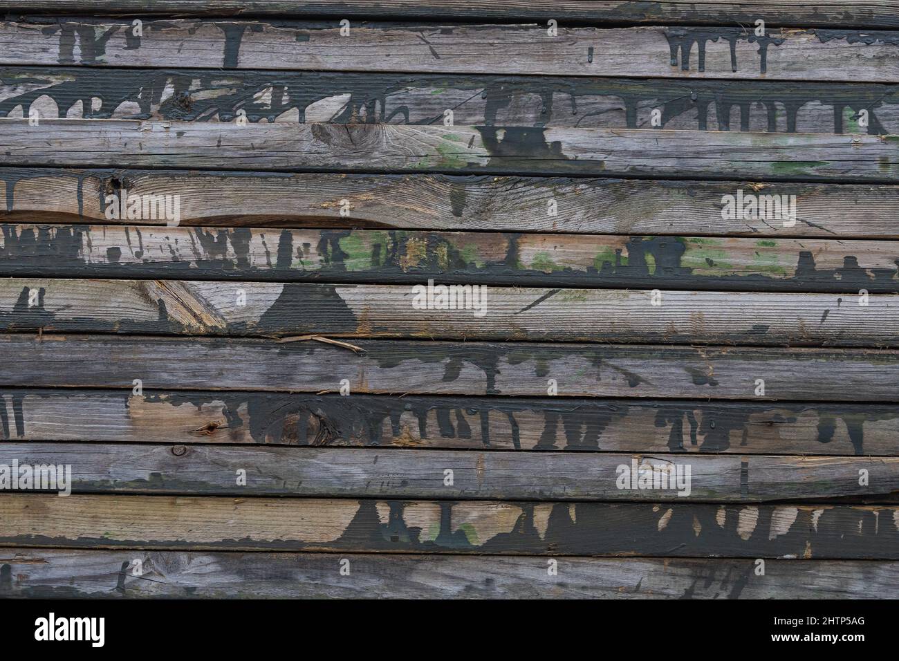 Close-up of wooden painted boards stacked tightly on top of each other ...
