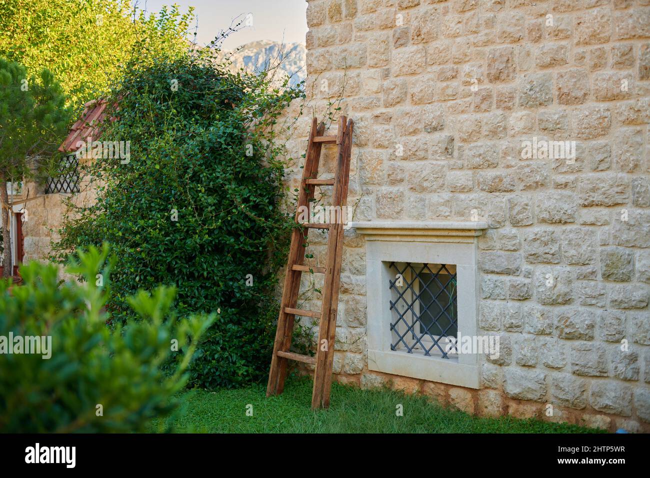 white stone wall with stairs and lawn Stock Photo - Alamy