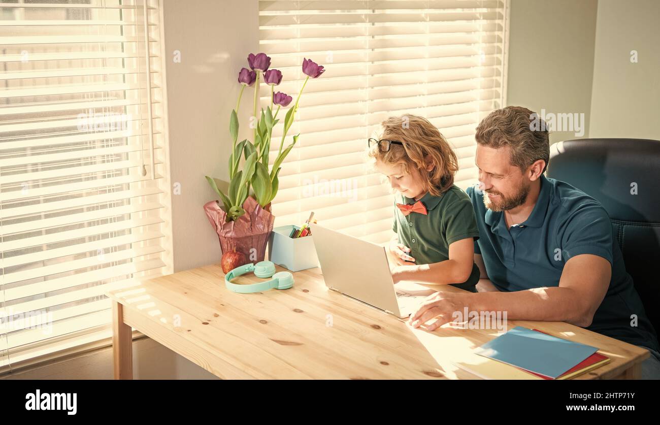 happy daddy or teacher helping his school son kid in glasses study with ...