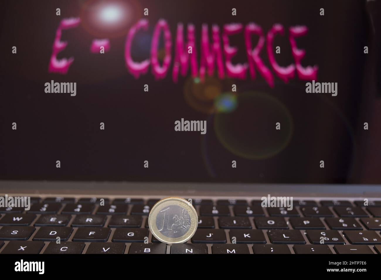 concept of e-commerce with one euro on a keyboard and the phrase on the ...