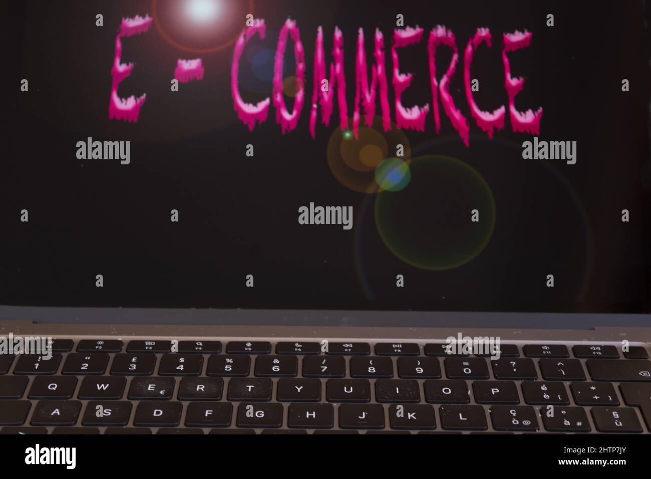 concept of e-commerce with a keyboard and the phrase on the backgorund ...