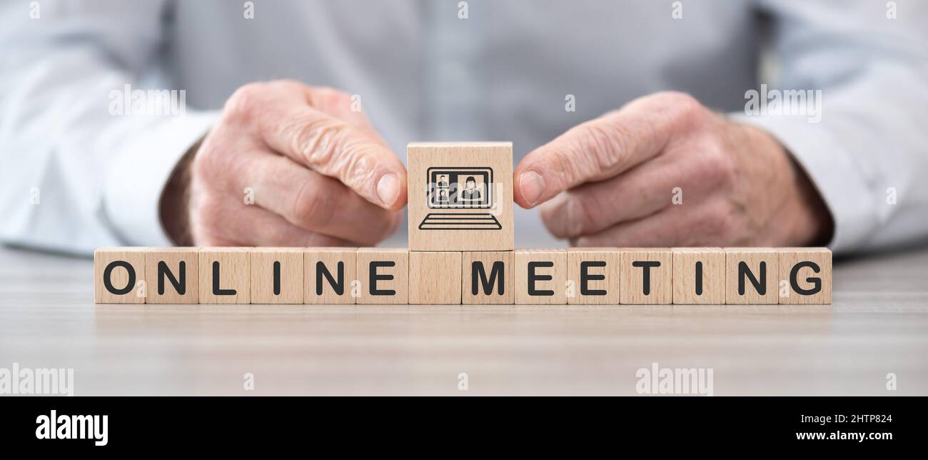 Wooden blocks with symbol of online meeting concept Stock Photo - Alamy