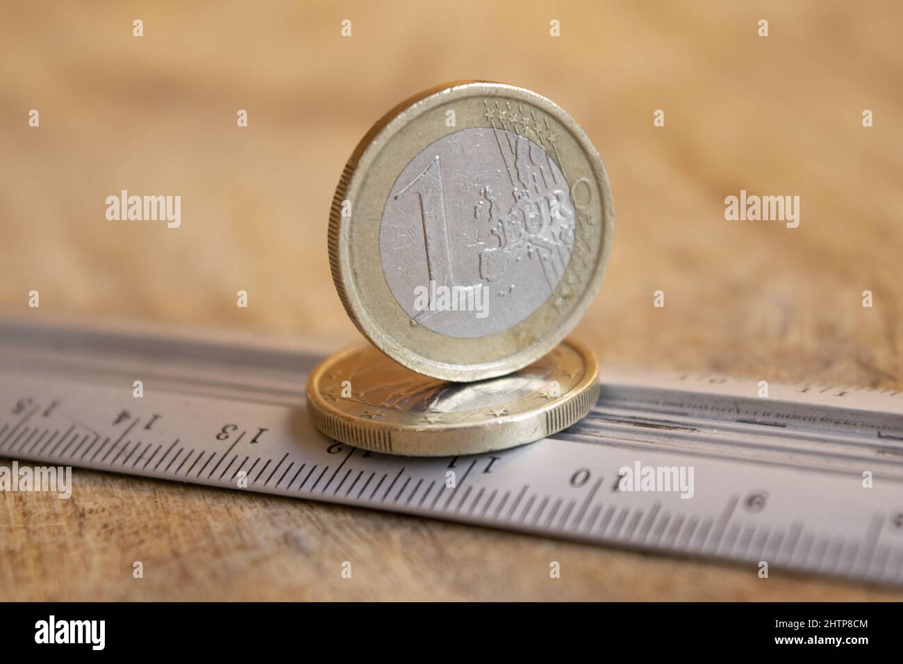 concept of money growth with one euro and a ruler Stock Photo - Alamy