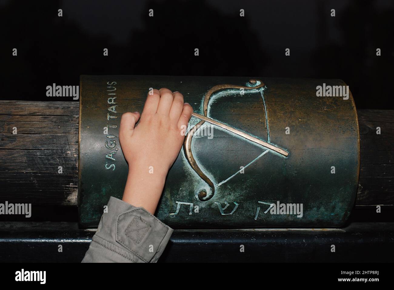 Wishing bridge in Tel Aviv in Israel, hand on the zodiac sign ...