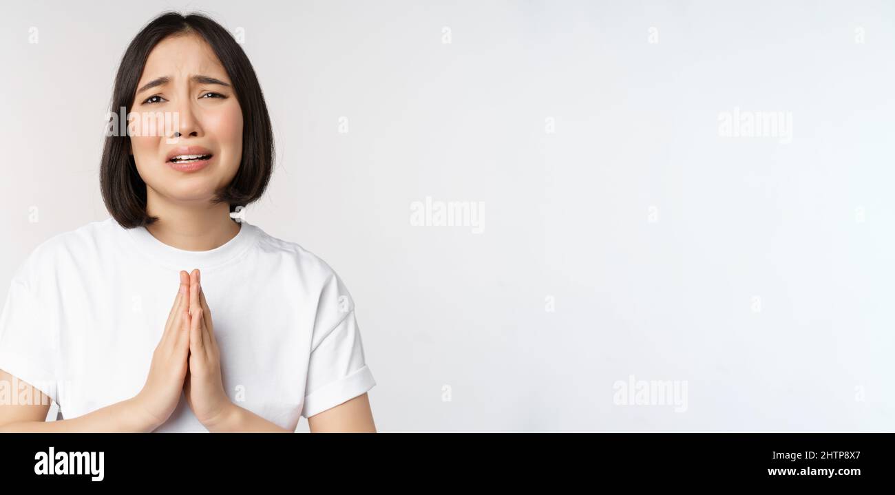 Desperate Crying Asian Woman Begging Asking For Help Pleading And Say