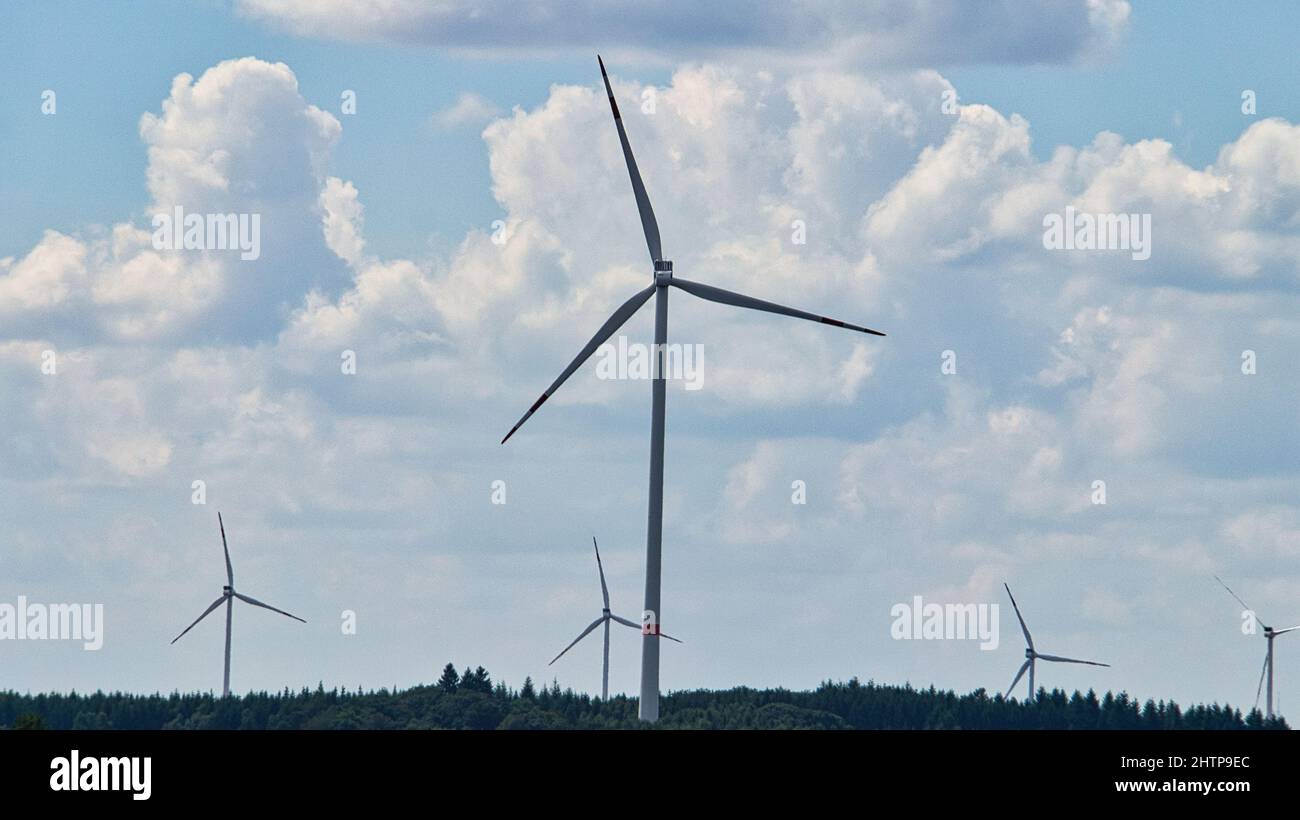 Windmill in foggy landscape. Renewable energy for environmentally ...