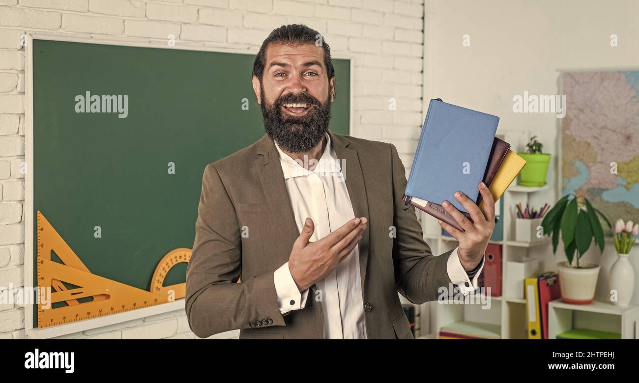 man with beard and moustache look as businessman or teacher in college ...