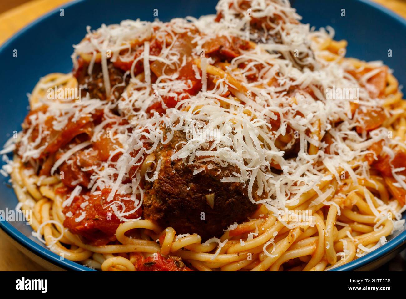 Dish of Beef meatballs and spaghetti with a marinara sauce and parmesan ...