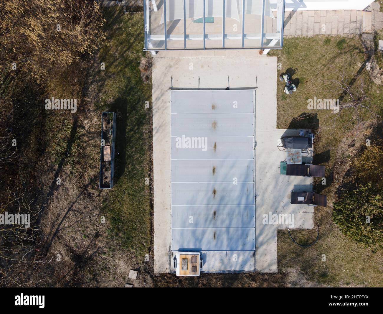 Drone flight over a covered pool with a tarp that is still under ...