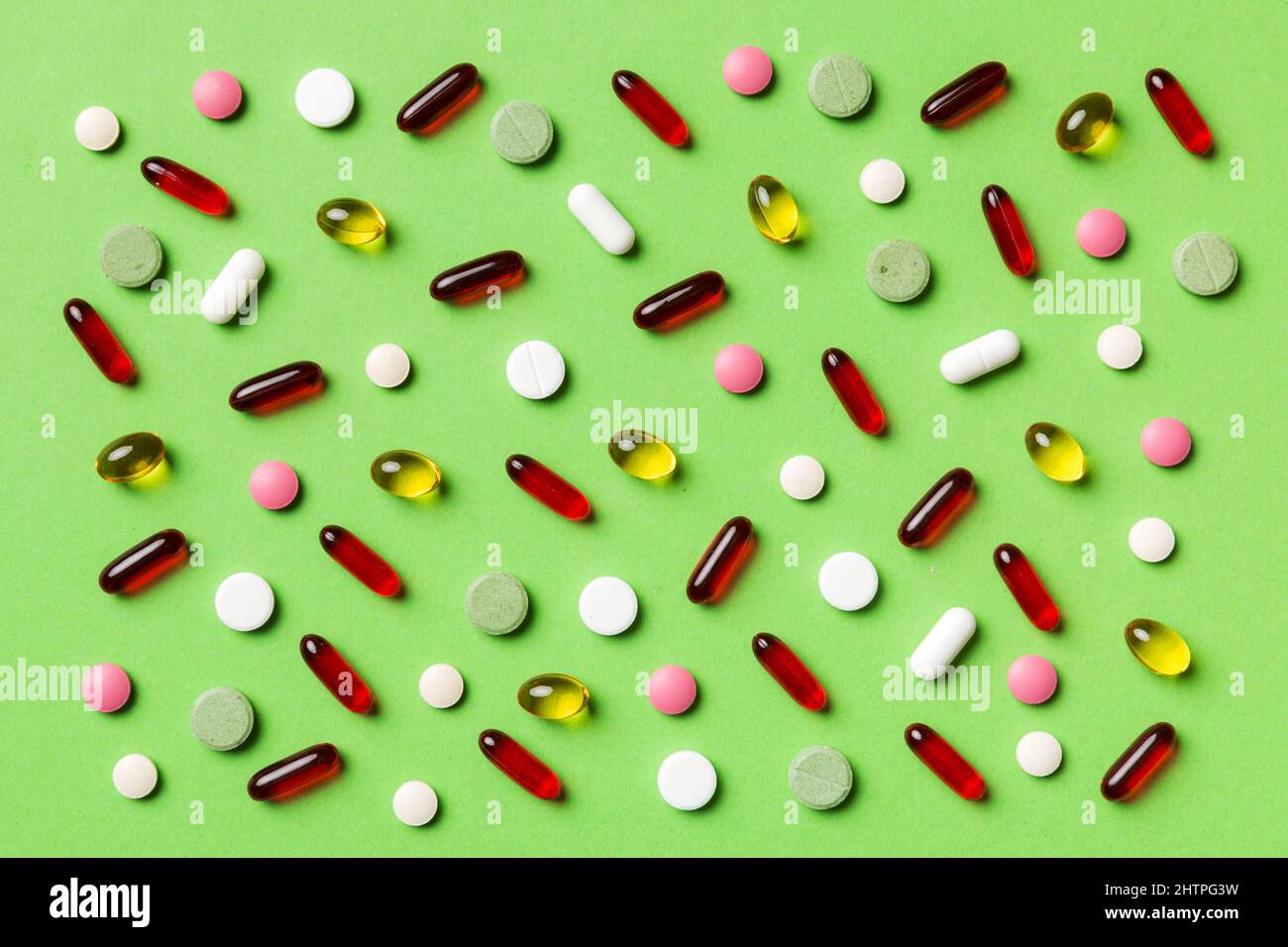 Many different pills and space for text on colorful background, top ...
