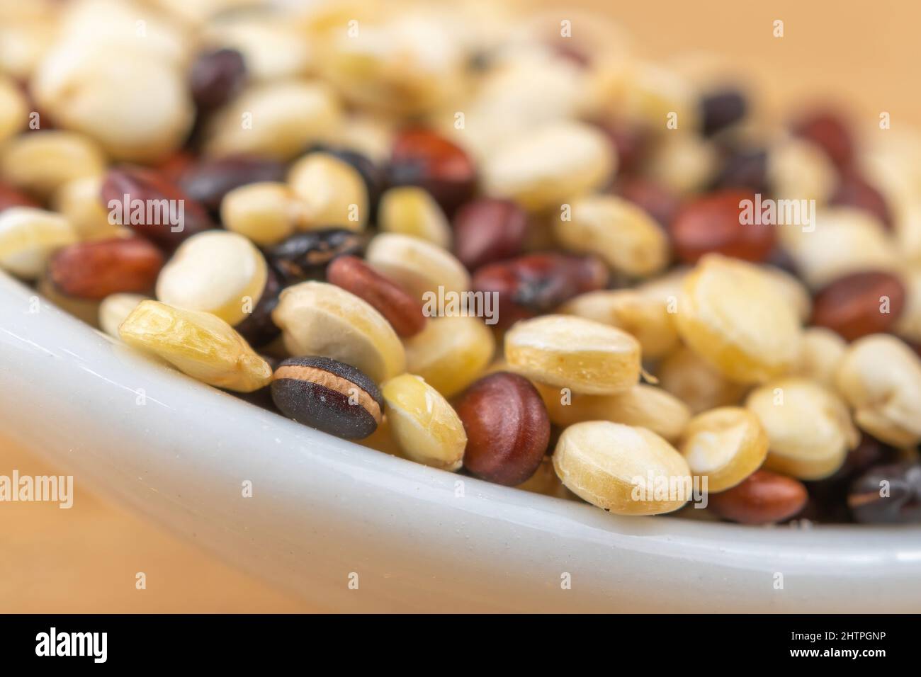 Macro of tri-colour quinoa grains in wood background Stock Photo - Alamy
