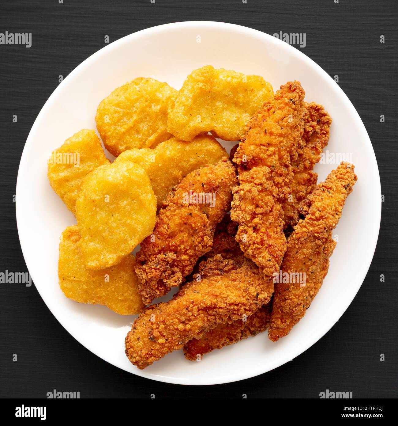 Homemade Nuggets and Chicken Tenders with Sweet and Sour Sauce on a ...