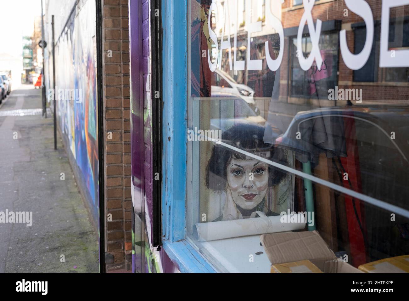 Painting in a shop window of the actress Helen McCrory in her role as ...