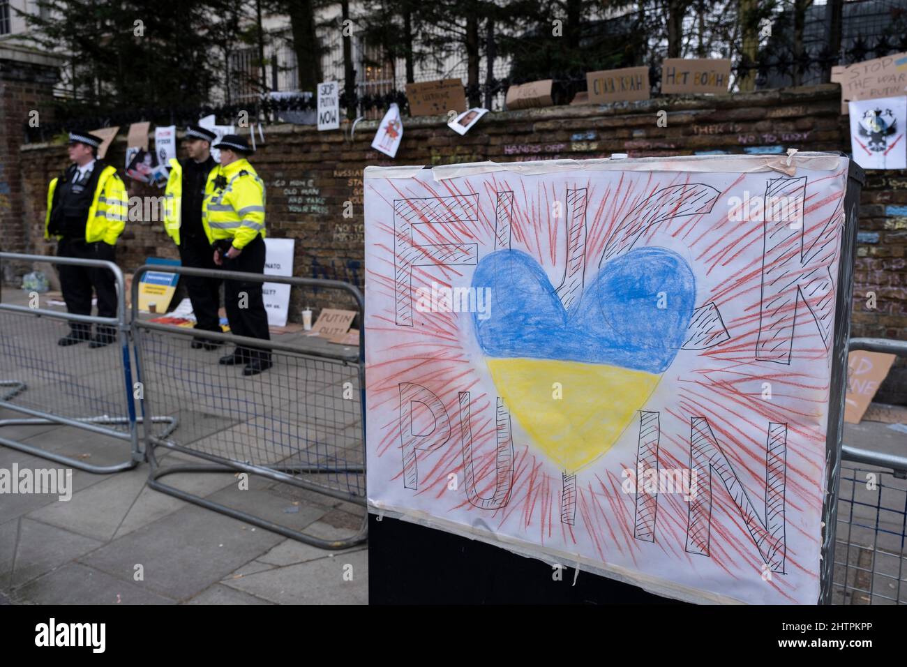 EDITORS NOTE: Image contains profanity Police on watch outside the ...