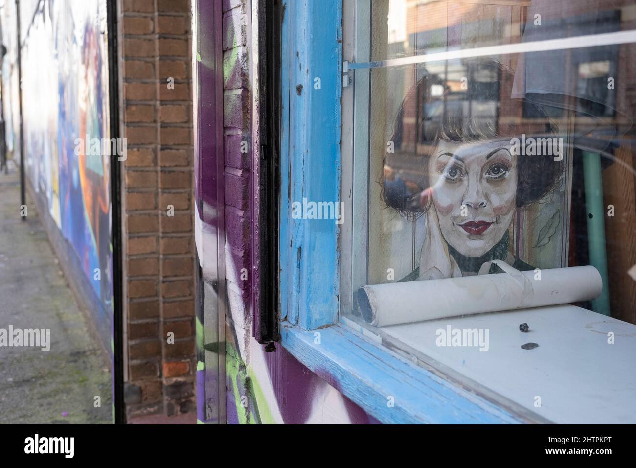 Painting in a shop window of the actress Helen McCrory in her role as ...
