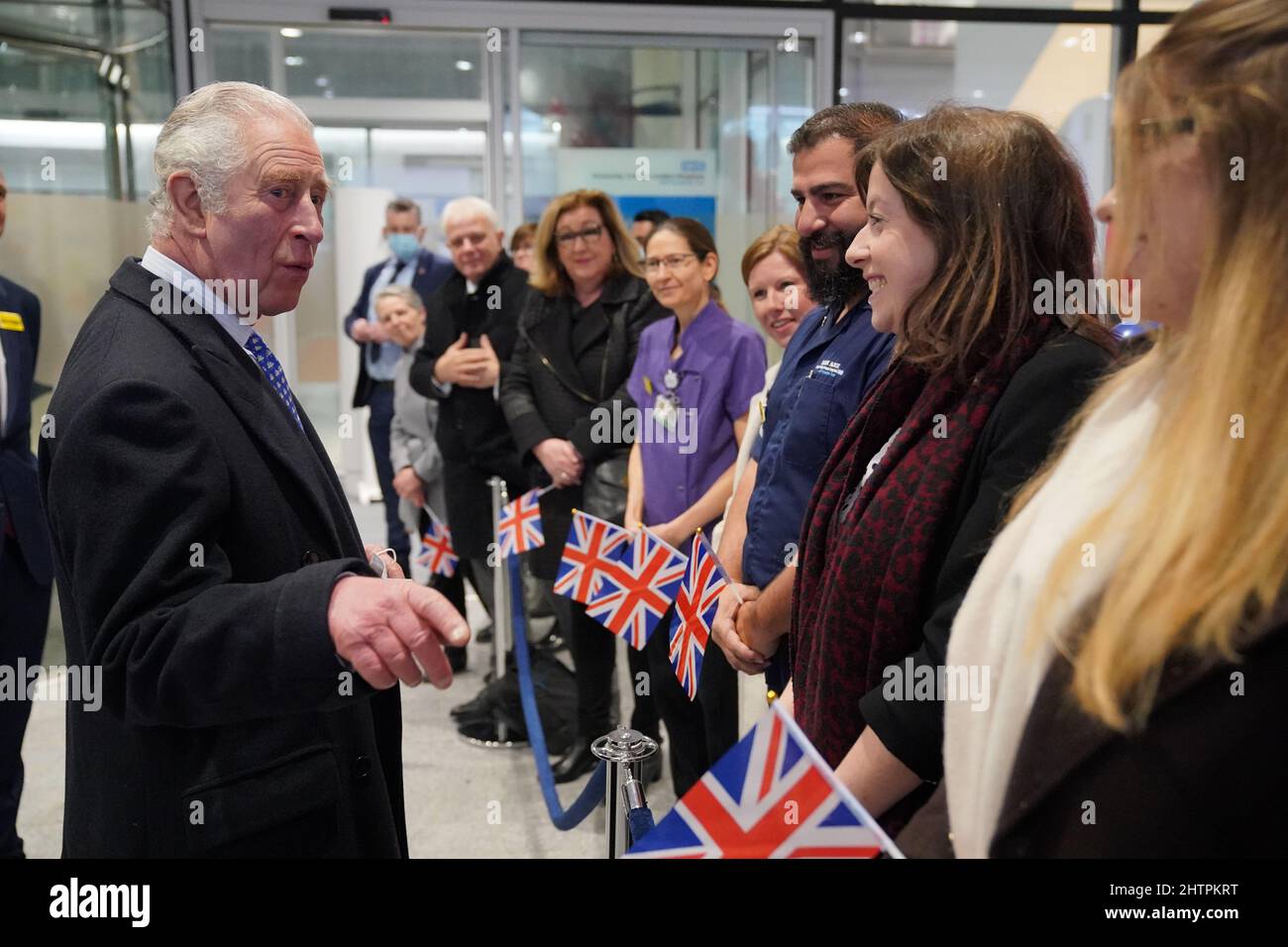 The Prince of Wales (left) meets staff during his visit to open the ...