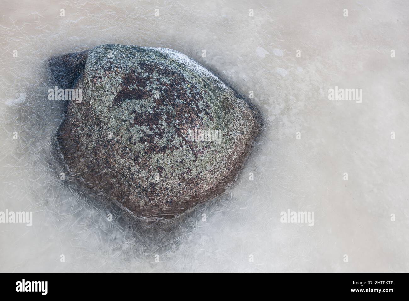Stone frozen in sea, Sweden Stock Photo - Alamy