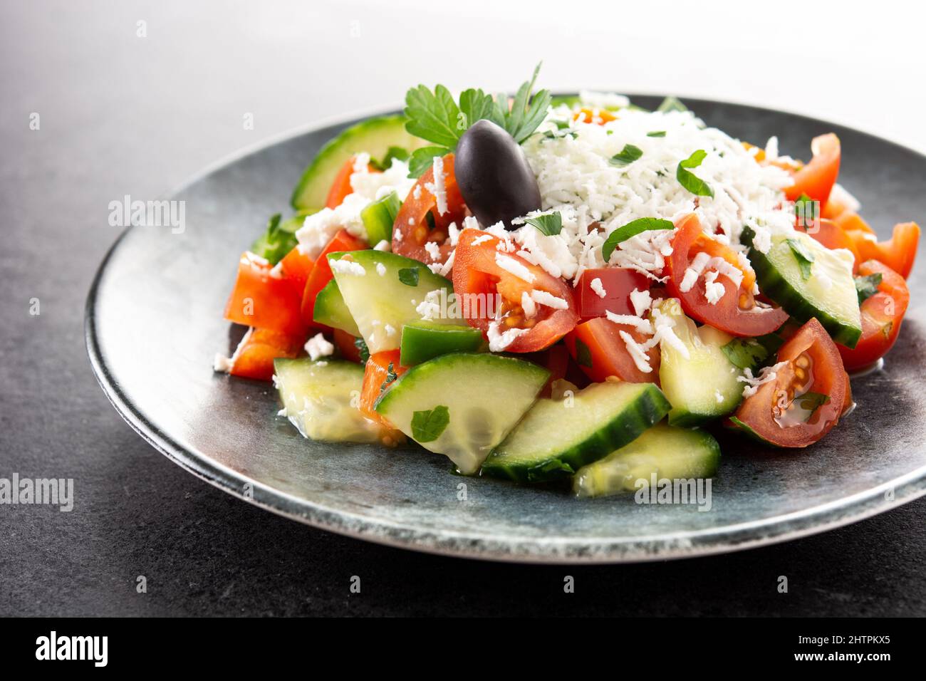 Traditional Bulgarian shopska salad with tomato,cucumber and bulgarian ...