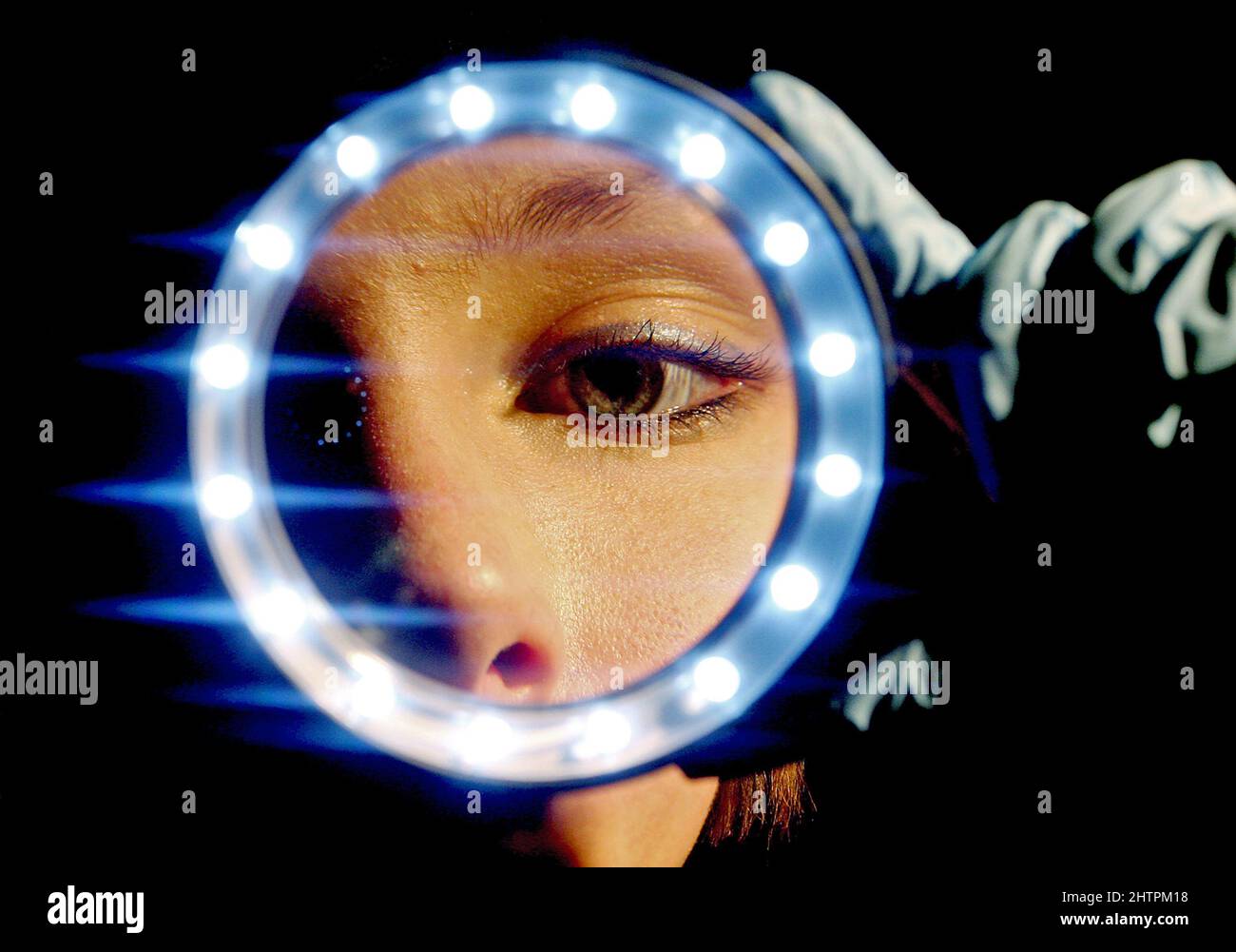 Close up generic science image of a scientist performing an examination ...