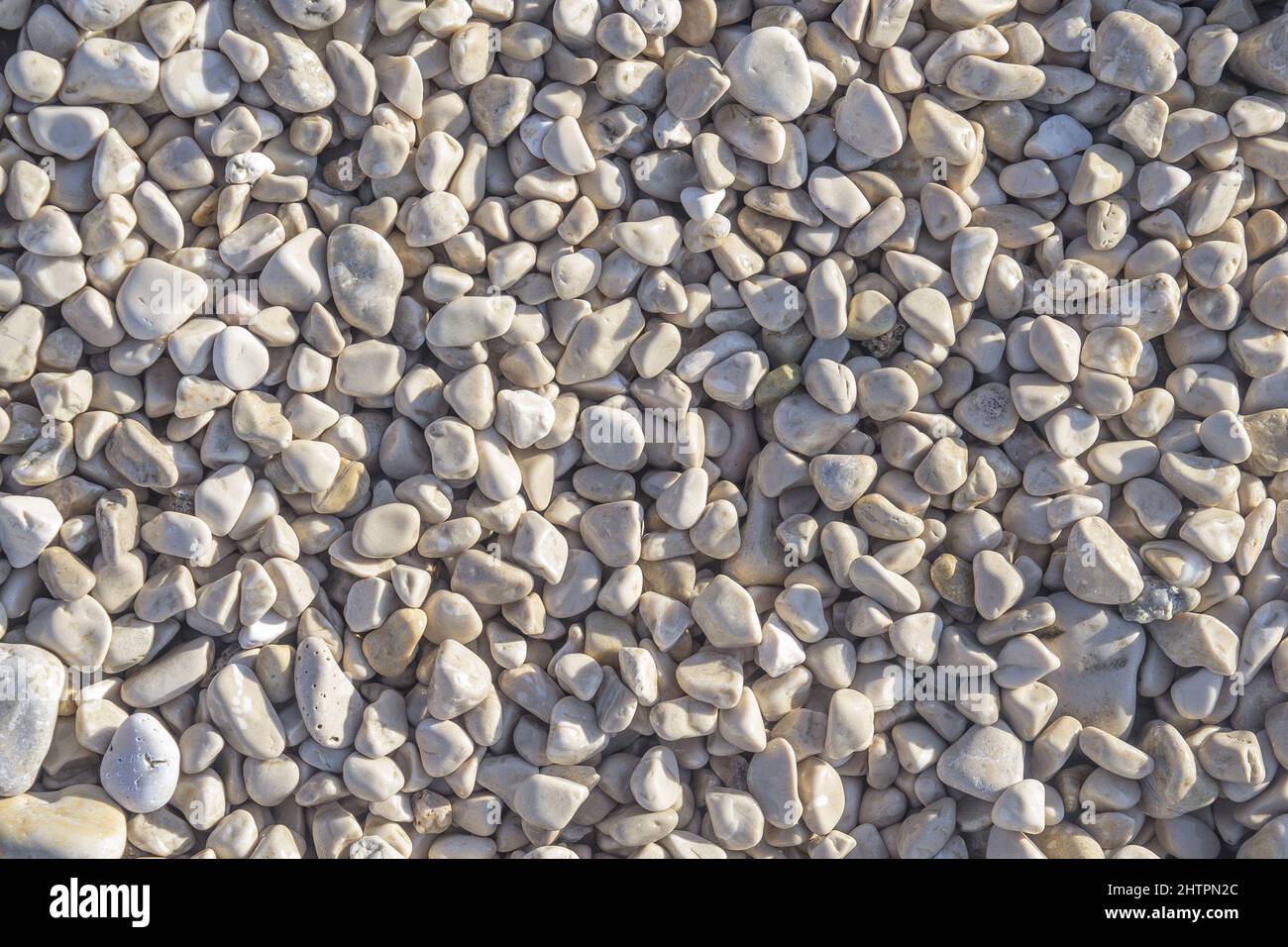 Closeup of wet pebbles and river stones on the beach. Great for ...