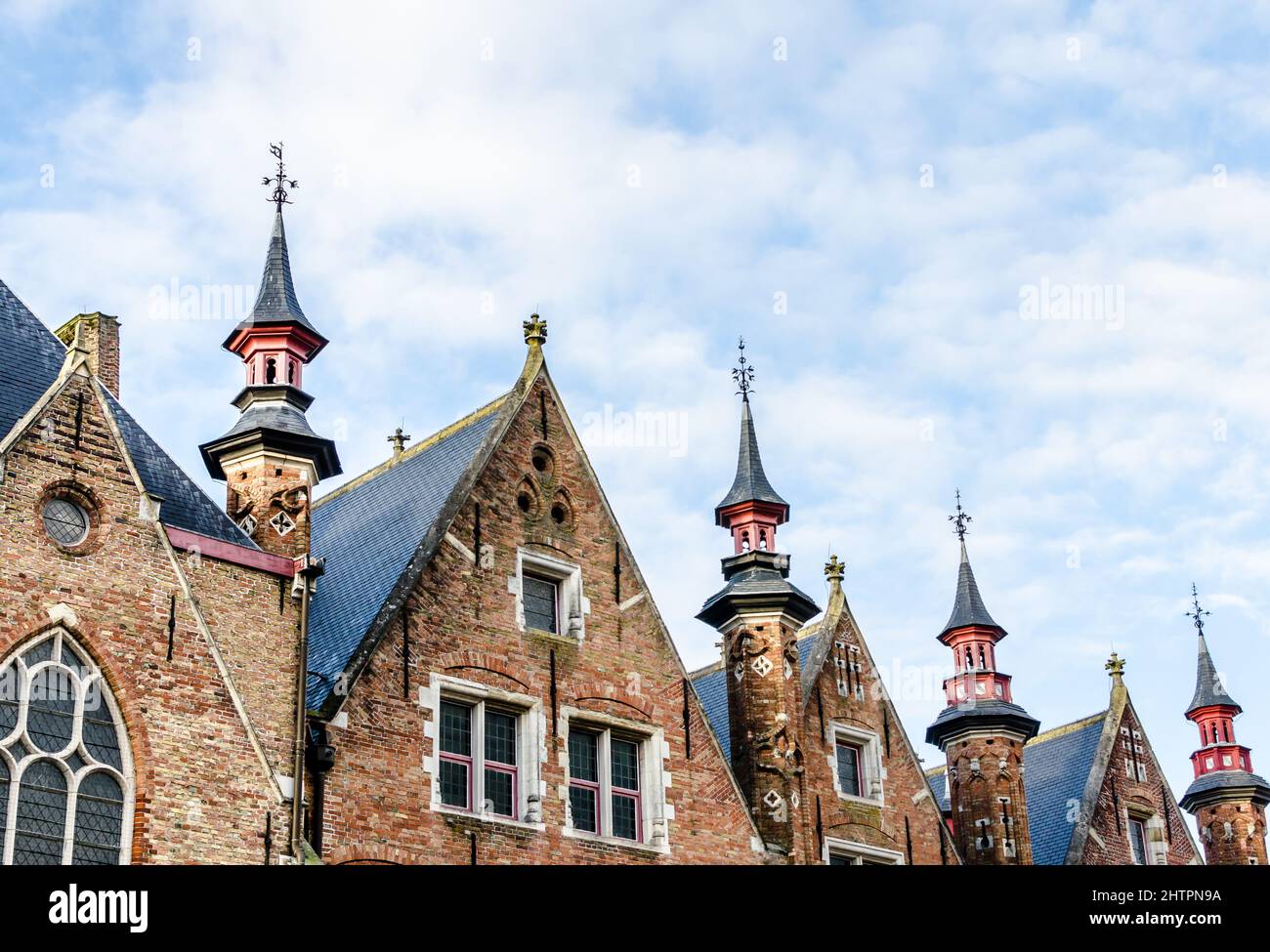Bruges, Belgium; view of the medieval buildings that are crossed by the ...