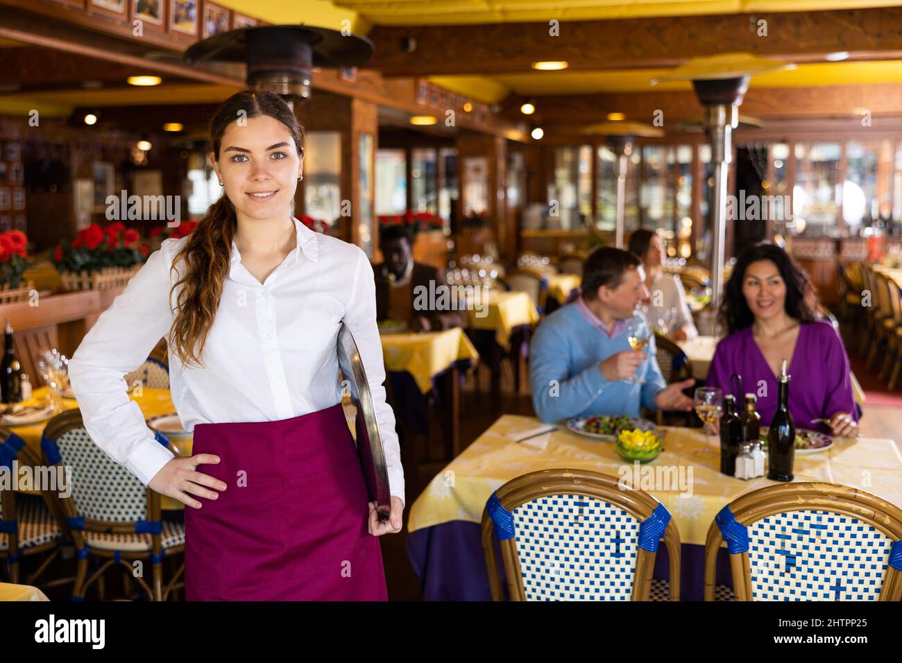 Young brunette waitress uniform hi-res stock photography and images - Alamy