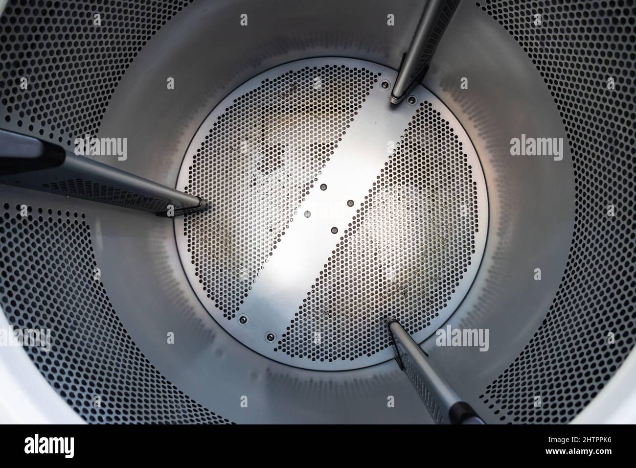 In the washing machine. The tub is made of stainless steel, perforated ...