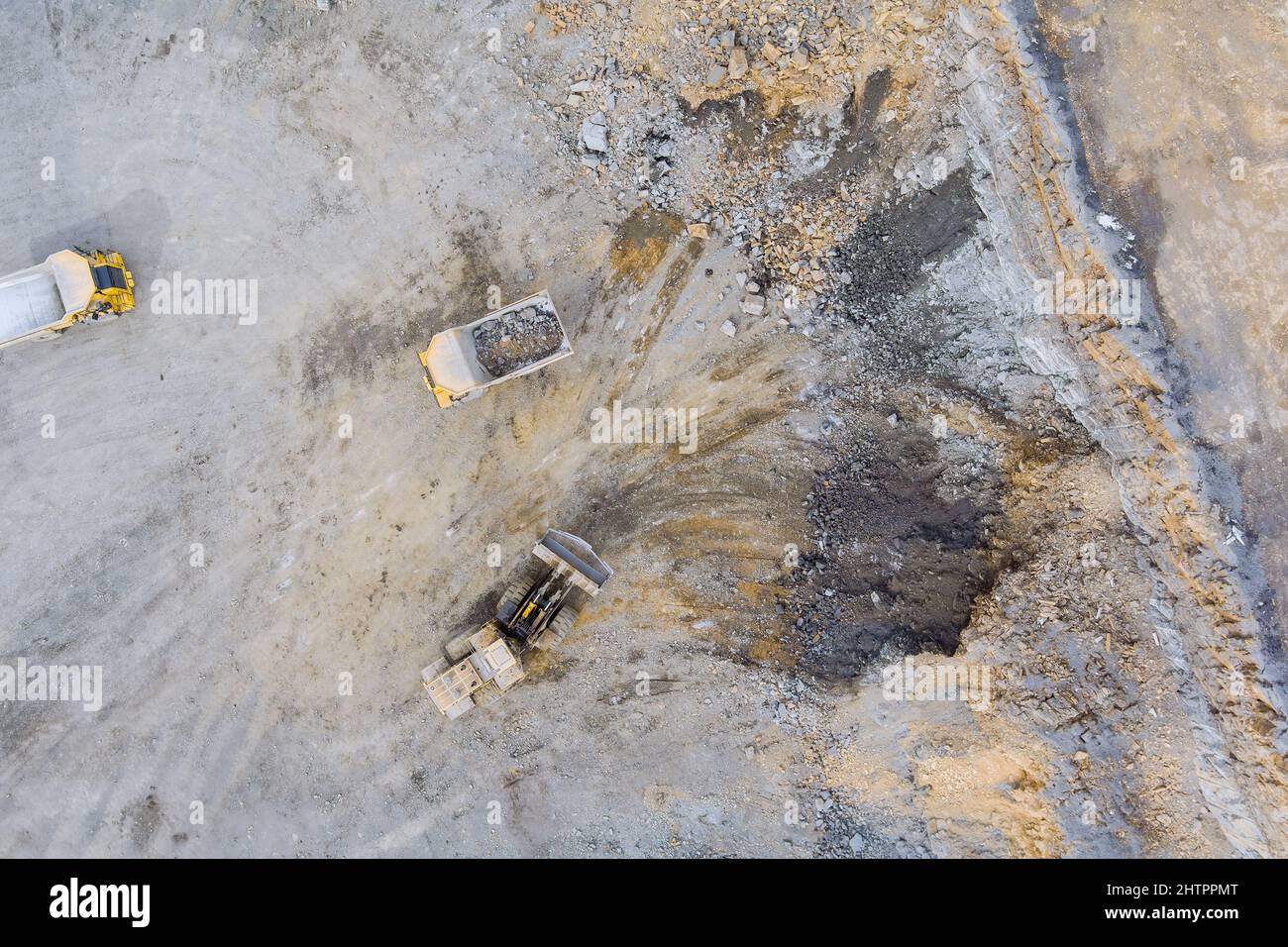 Open pit mining of loading the stone gravel into heavy dump truck at ...