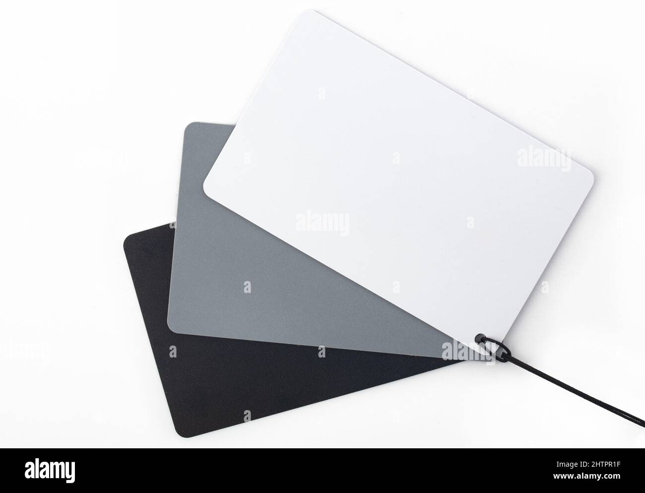 White, gray and black color balance card isolated over white background ...