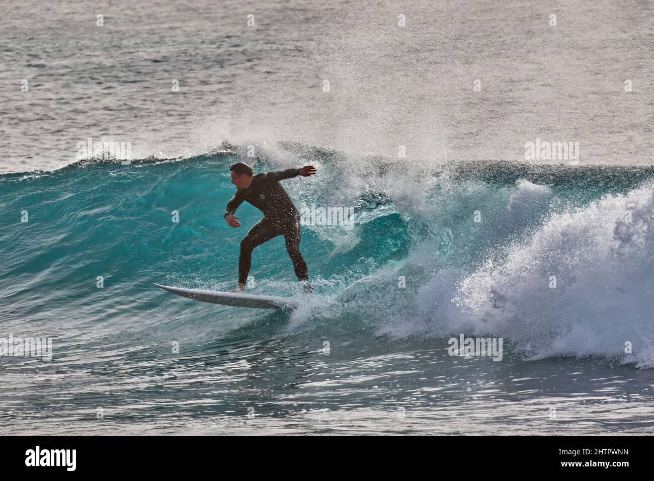 Surfing on Atlantic waves at Ponta Preta, southwest coast of Sal island ...
