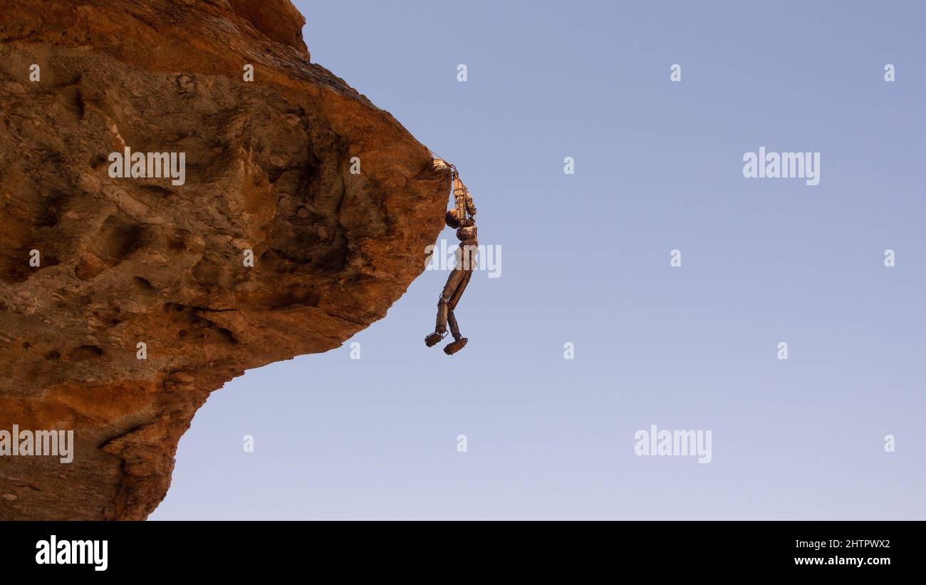 Puros, Namibia-August 2, 2021- Side view of a stone man hanging from a ...