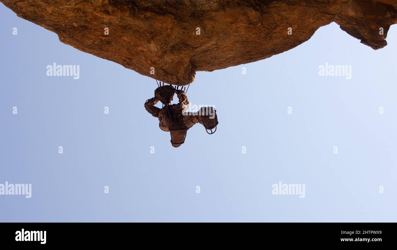 Puros, Namibia-August 2, 2021- Side view of a stone man hanging from a ...