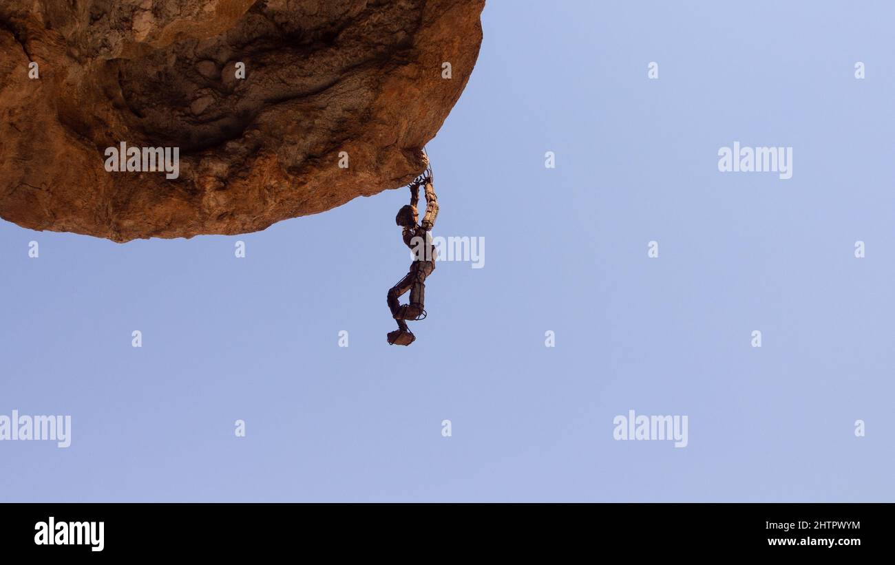 Puros, Namibia-August 2, 2021- Side view of a stone man hanging from a ...