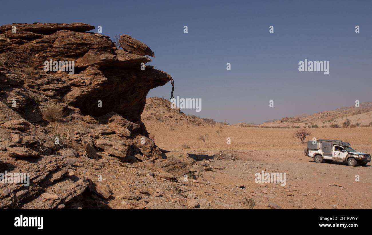 Puros, Namibia-August 2, 2021- Side view of a stone man hanging from a ...