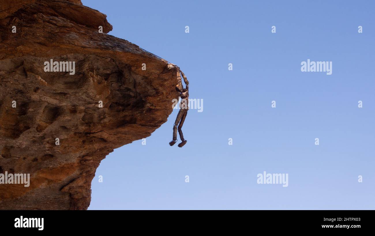 Puros, Namibia-August 2, 2021- Side view of a stone man hanging from a ...