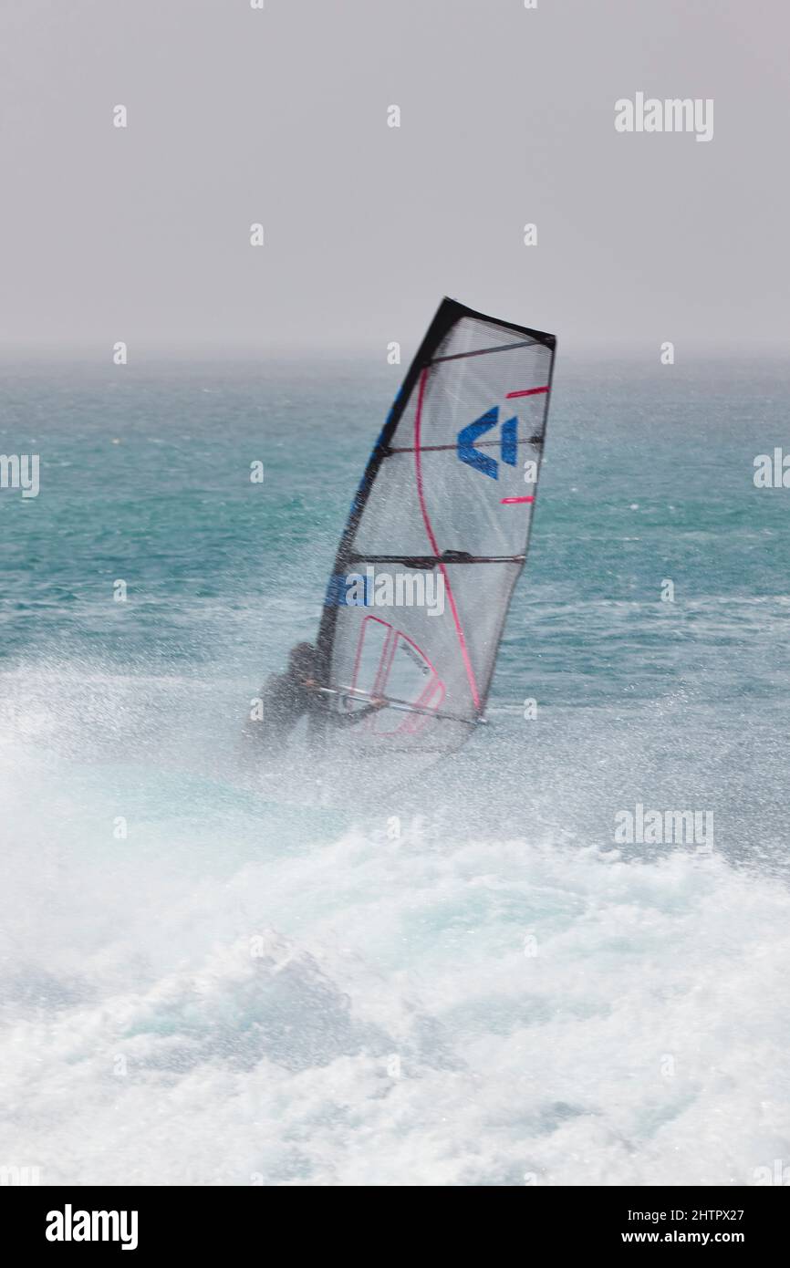 Wind-surfing down Atlantic waves at Ponta Preta, southwest coast of Sal ...