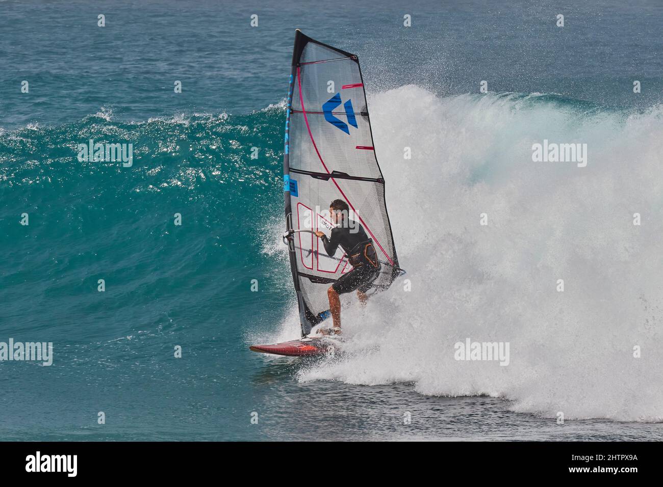 Wind-surfing down Atlantic waves at Ponta Preta, southwest coast of Sal ...