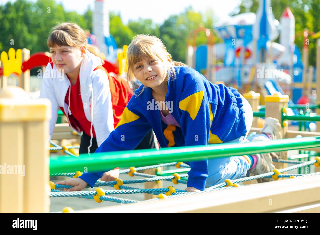 Happy girls playing outdoors Stock Photo - Alamy