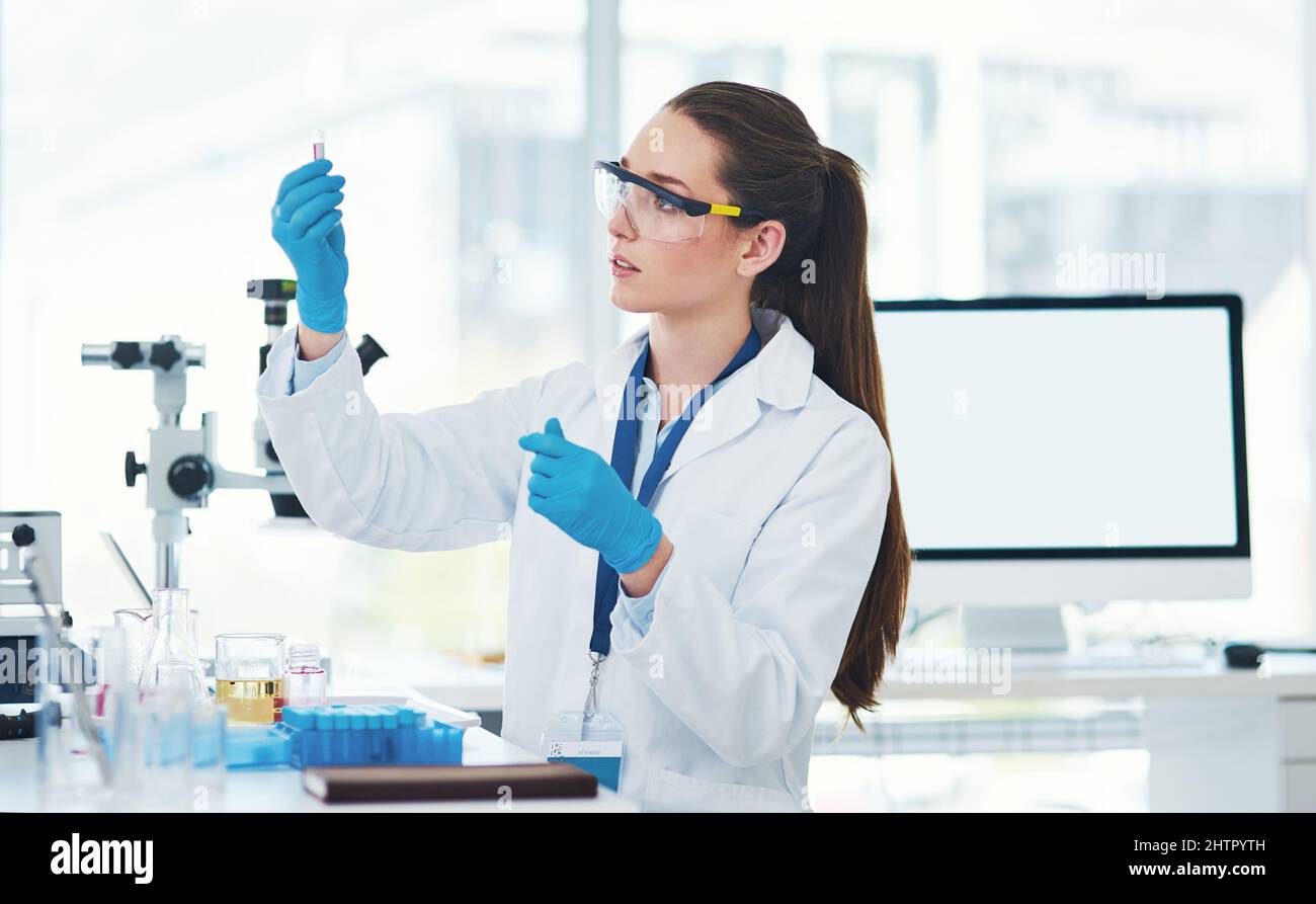 Scientist mixing chemicals hi-res stock photography and images - Alamy