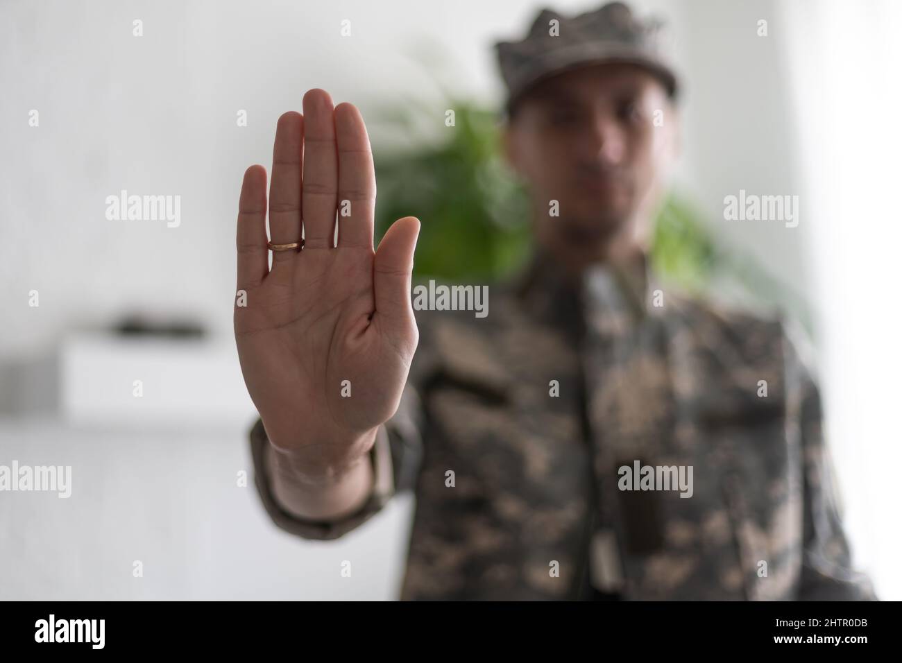 security officer making the stop sign. military Stock Photo - Alamy