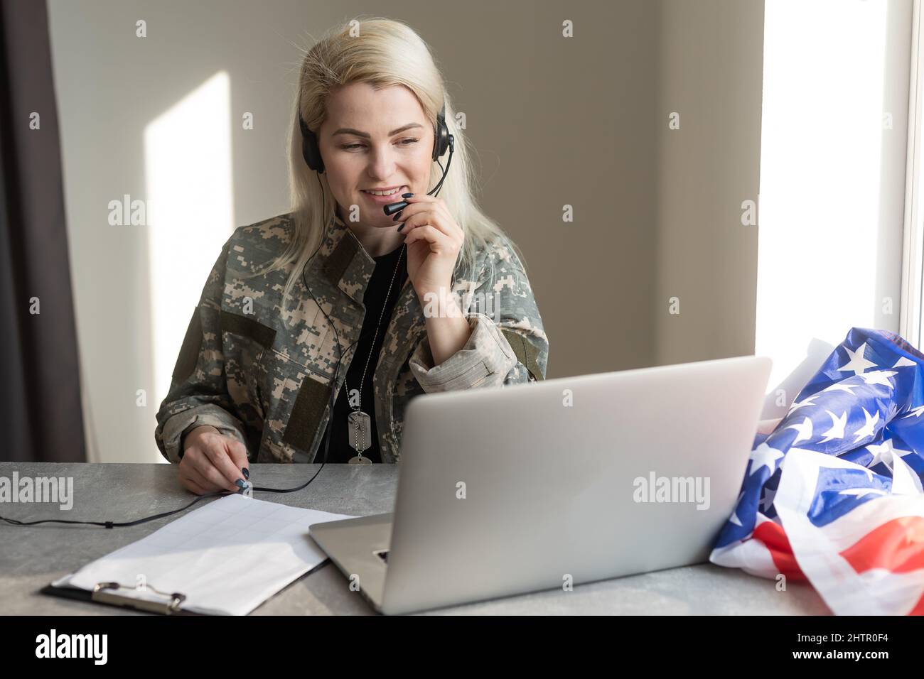 female soldier video chatting with family Stock Photo - Alamy