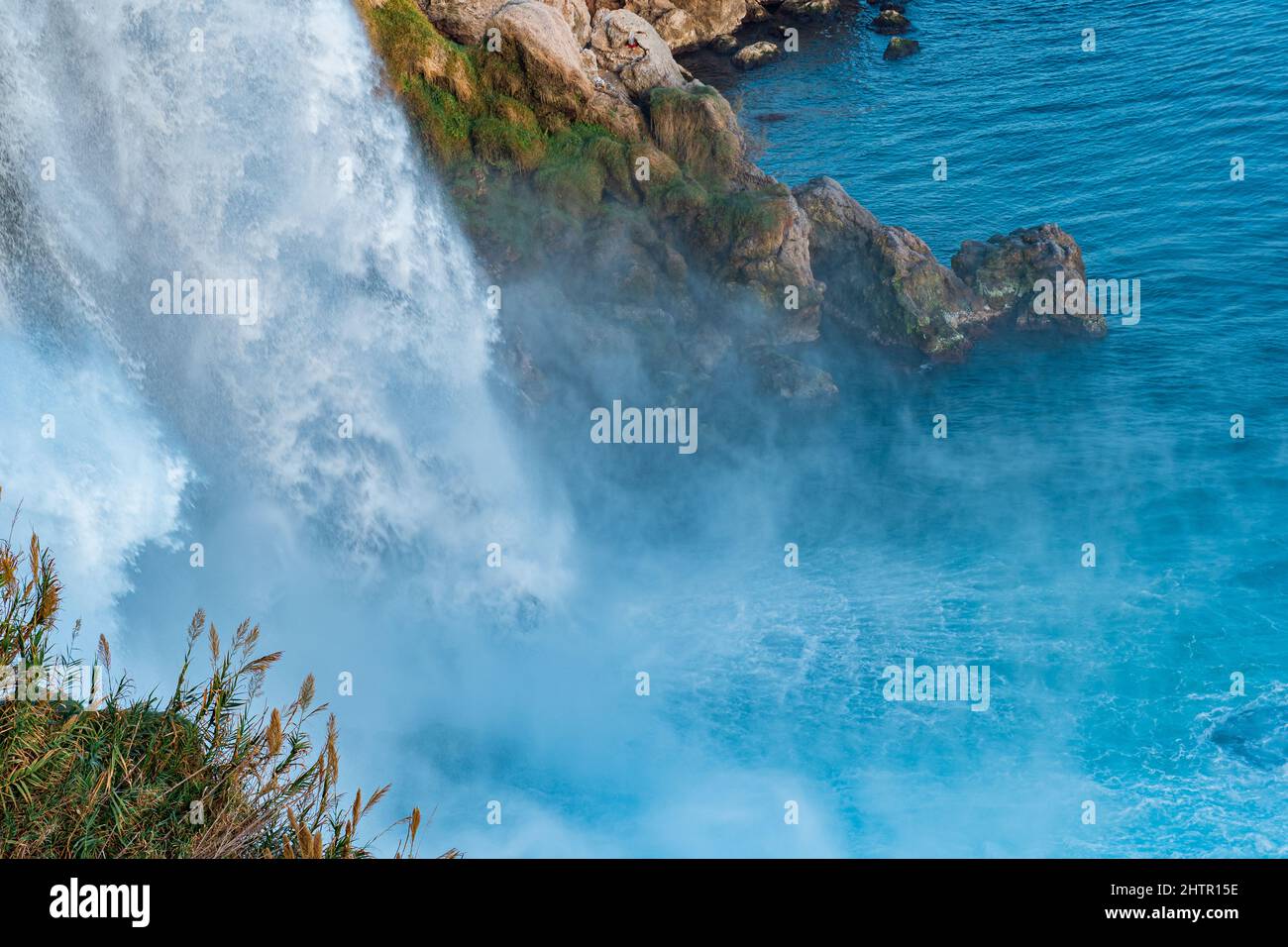 foot of a waterfall falling into the sea from a cliff, Lower Duden ...