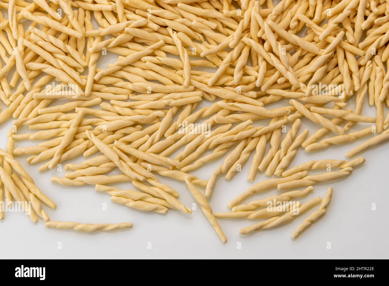 Trofie pasta dried raw, typical Italian pasta from Liguria, close up on ...