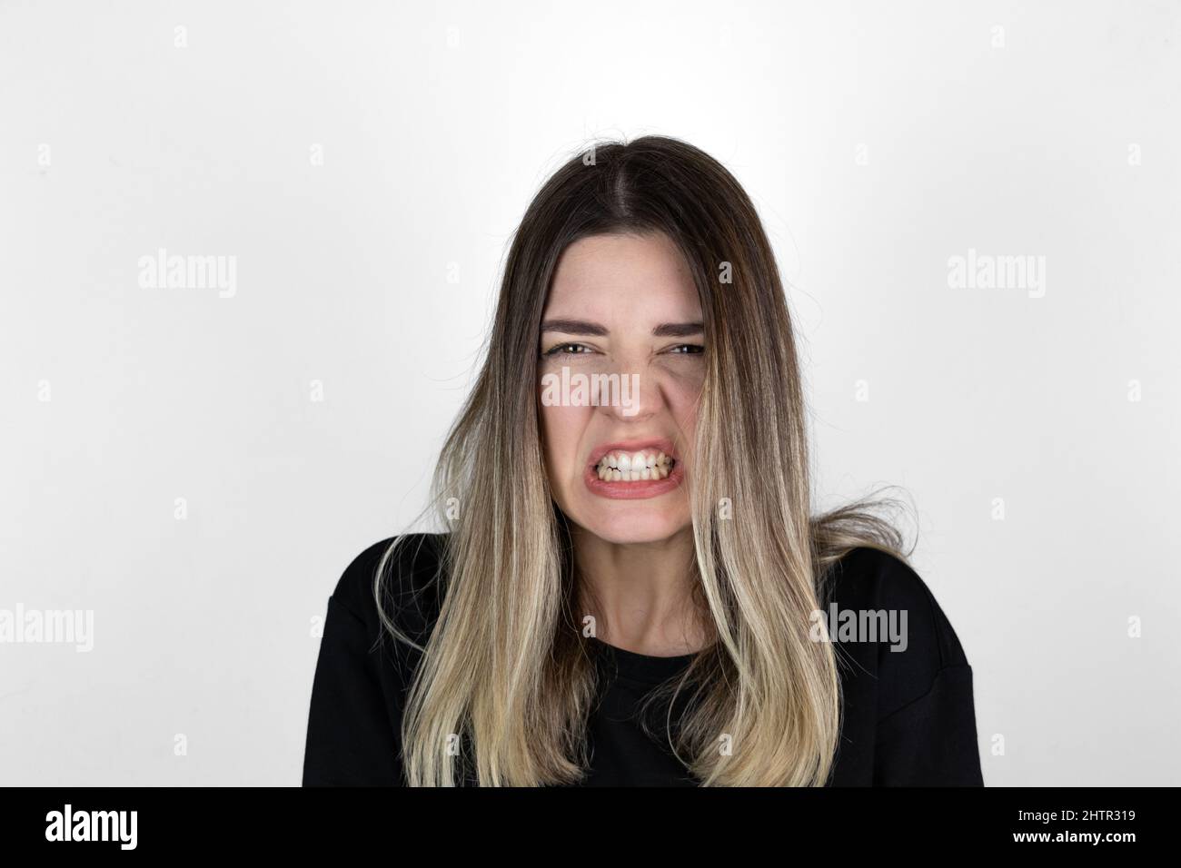 Angry girl screaming. White background. Lifestyle, emotions and ...