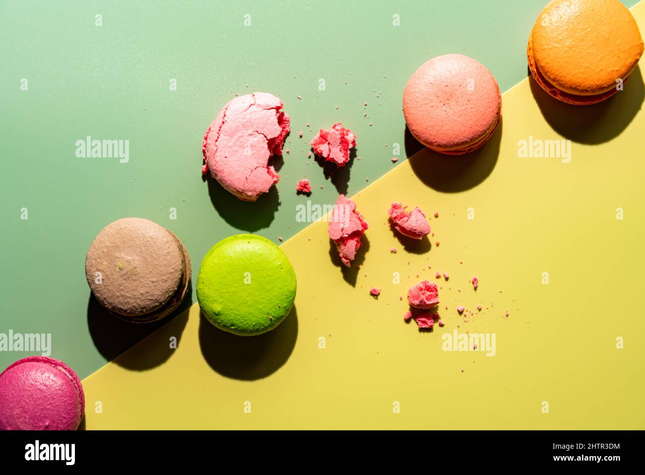 Cookie macaron or macaroon on colorful bright background from above ...