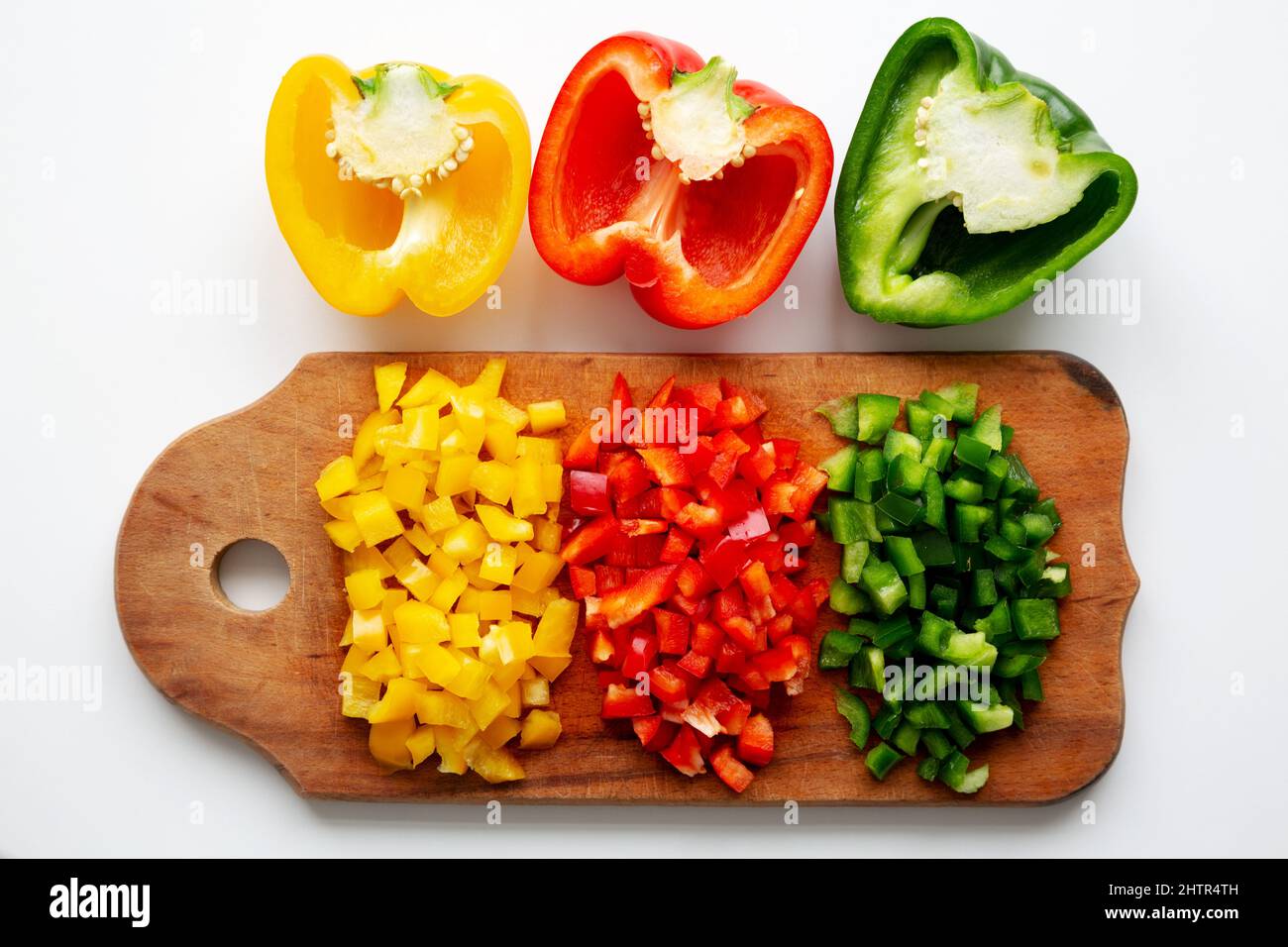 Chopped Fresh Colored Peppers on a Rustic Wooden Board, top view. Flat ...