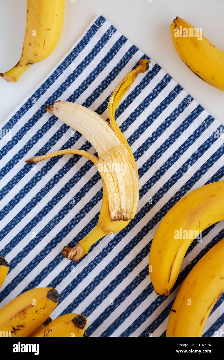 Raw Organic Bananas on cloth, overhead view. Flat lay, top view, from ...