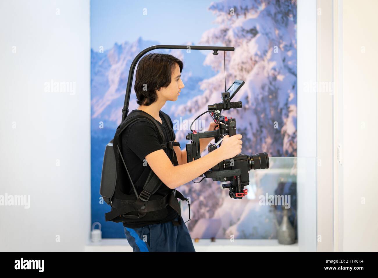 The camera man take photos and record video. Teenage boy learning Stock ...