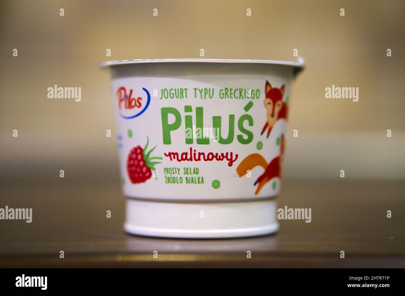 A shallow focus photo of Pilos brand Pilus dessert with raspberry in a ...